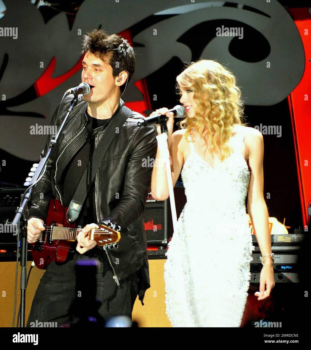 Singer John Mayer is joined by Taylor Swift on stage at the Z100 Jingle ...