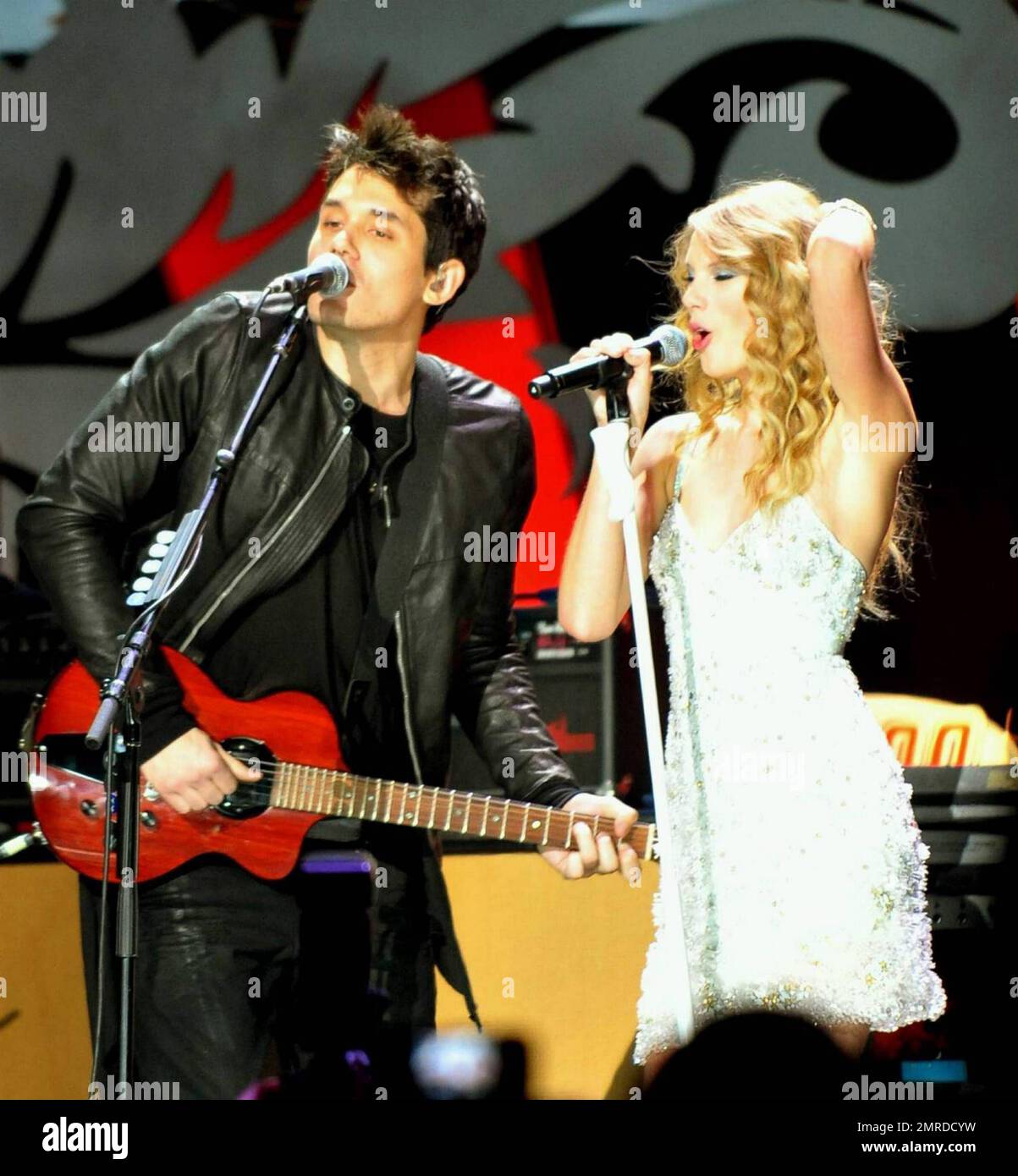 Singer John Mayer is joined by Taylor Swift on stage at the Z100 Jingle ...