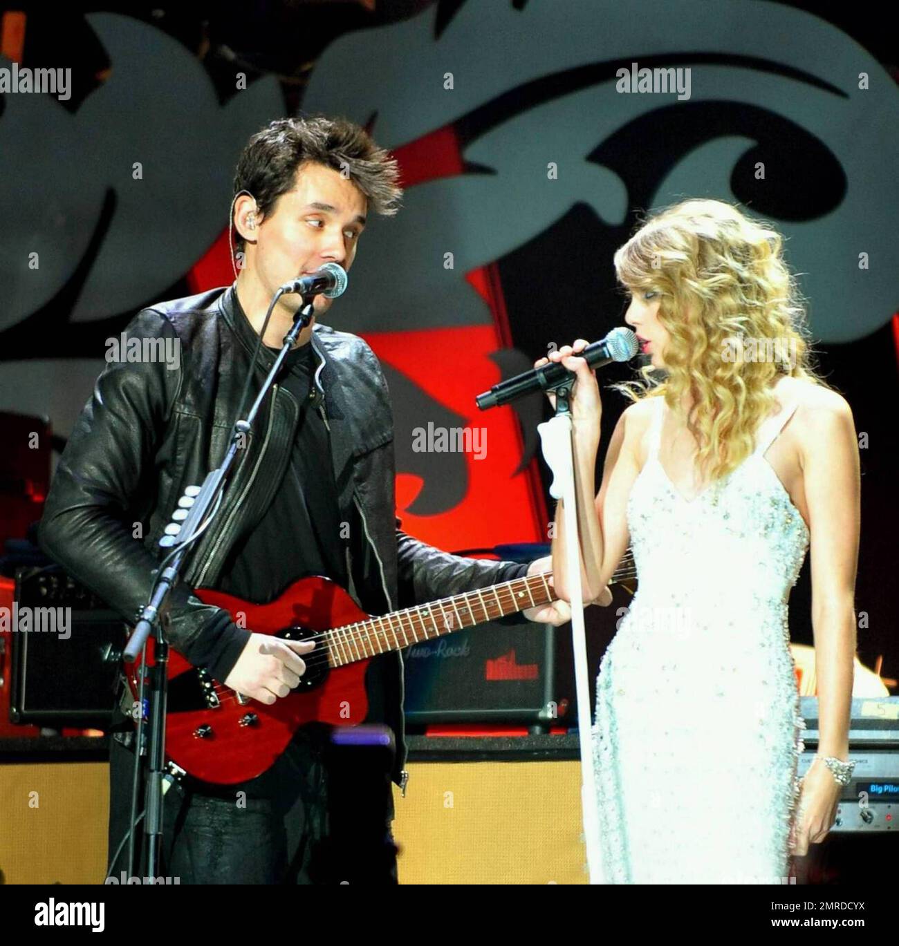 Singer John Mayer is joined by Taylor Swift on stage at the Z100 Jingle ...