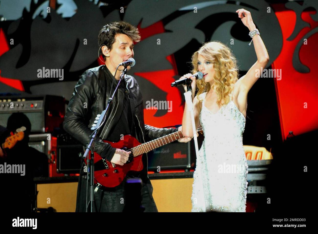 Singer John Mayer is joined by Taylor Swift on stage at the Z100 Jingle ...