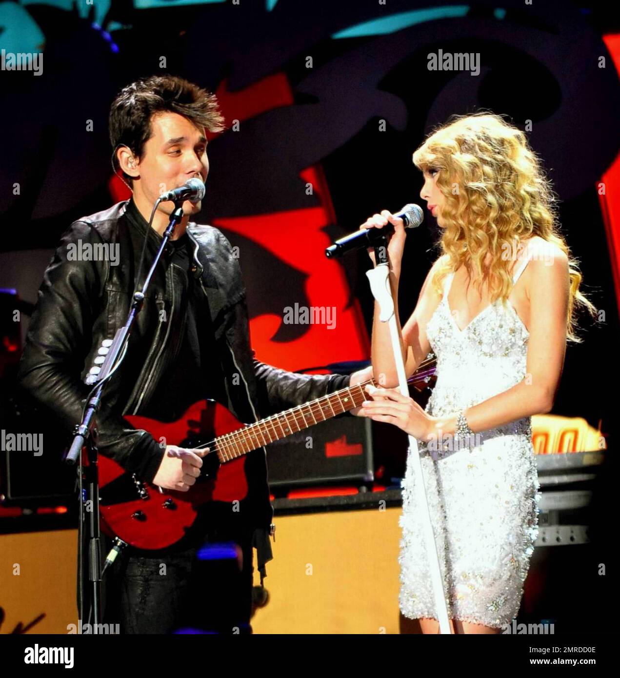 Singer John Mayer is joined by Taylor Swift on stage at the Z100 Jingle ...