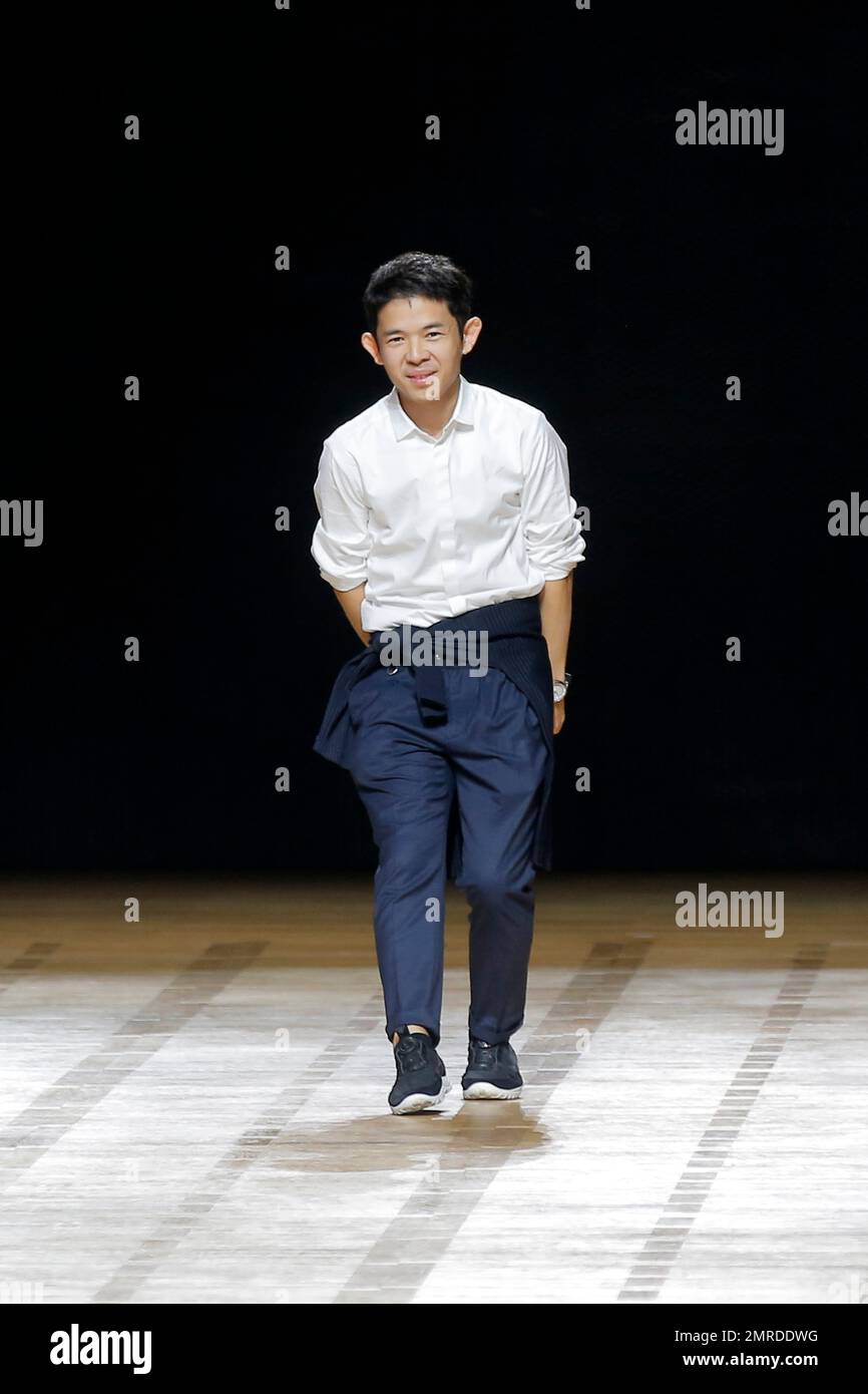 Japanese fashion designer Yoshiyuki Miyamae acknowledges applause after ...