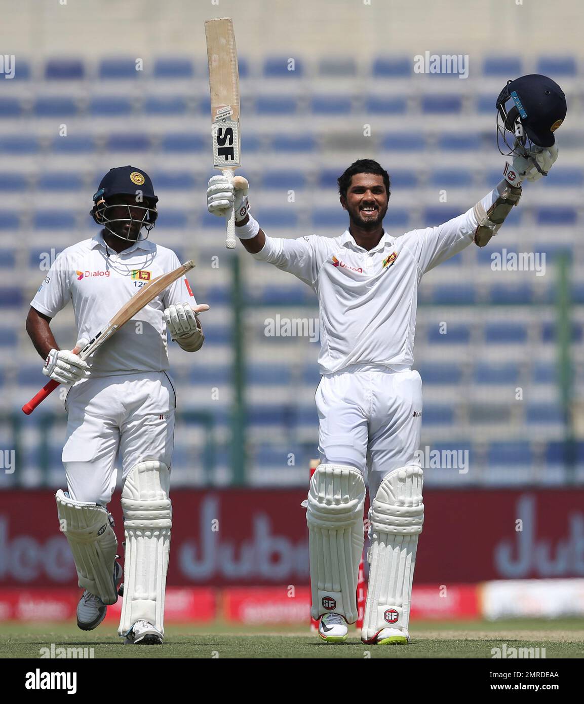 Sri Lanka's batsman Dinesh Chandimal celebrates reaching his century ...