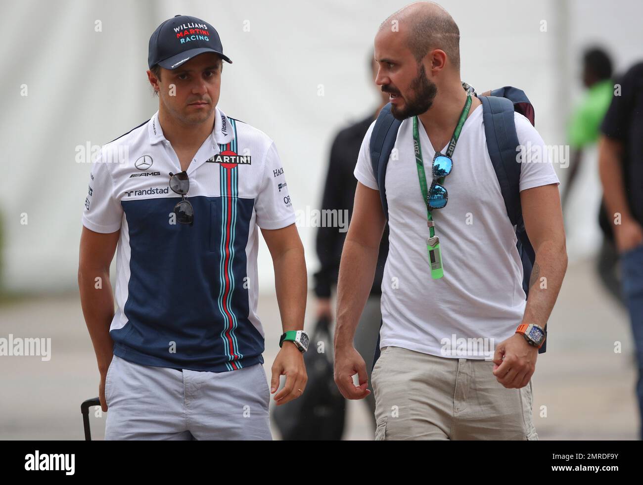 Williams driver Felipe Massa of Brazil, left, arrives for the first ...