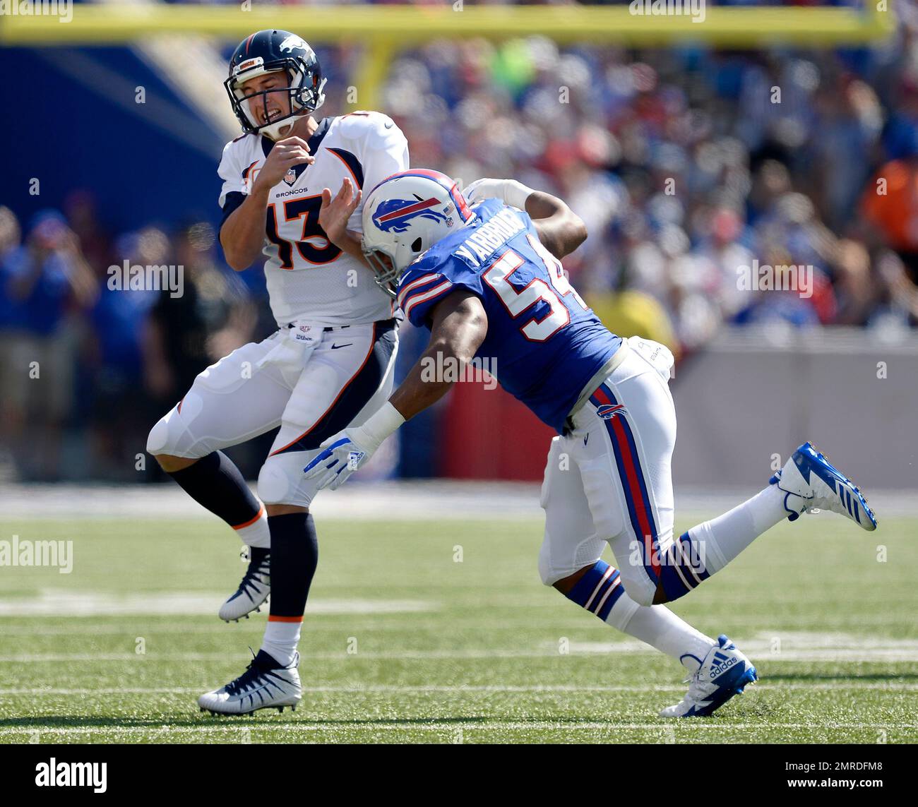 Denver Broncos quarterback Trevor Siemian (13) waits for a hit from ...