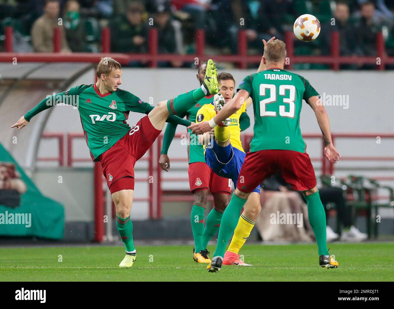 Lokomotiv's Mikhail Lysov, left, and Zlin's Lukas Zeleznik struggle for a ball during the Europa ...