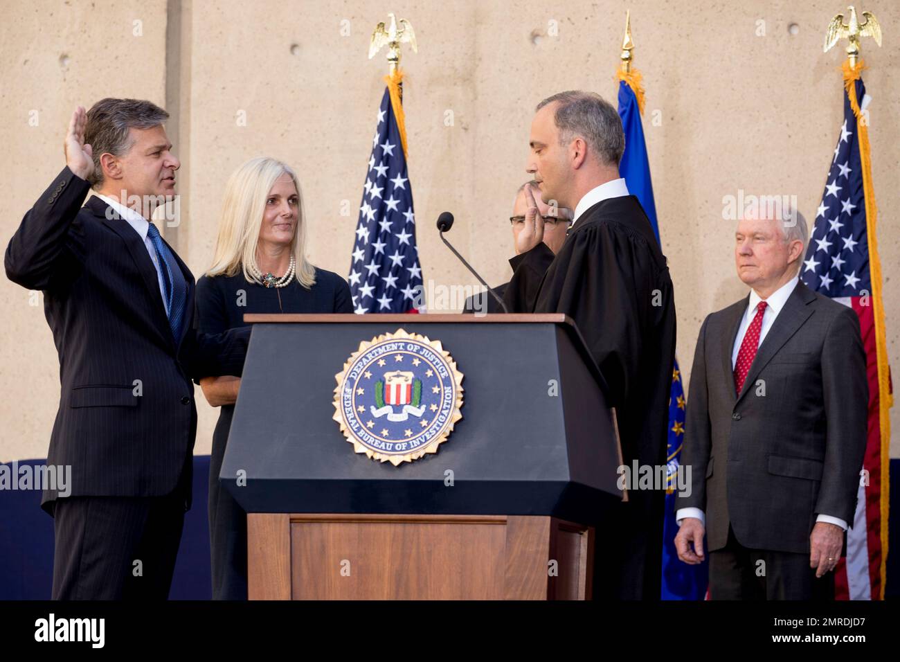 FBI Director Chris Wray, accompanied by his wife Helen Garrison Howell ...