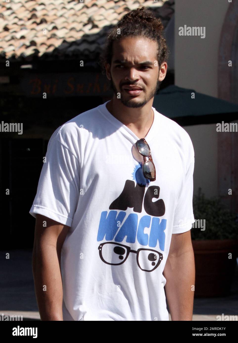Joakim Noah of the Chicago Bulls holds up the legs of his shorts as he ...