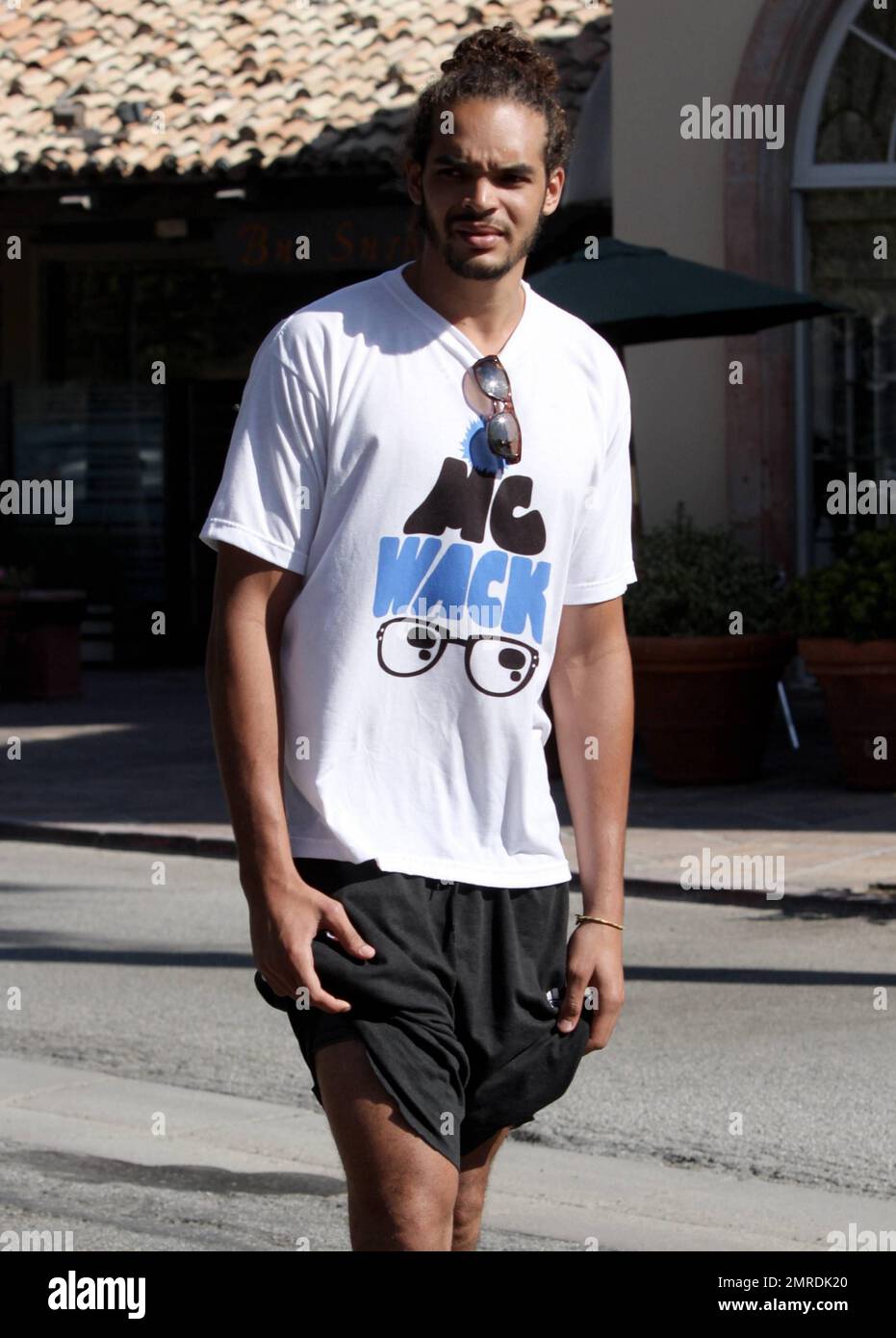 Joakim Noah of the Chicago Bulls holds up the legs of his shorts as he ...