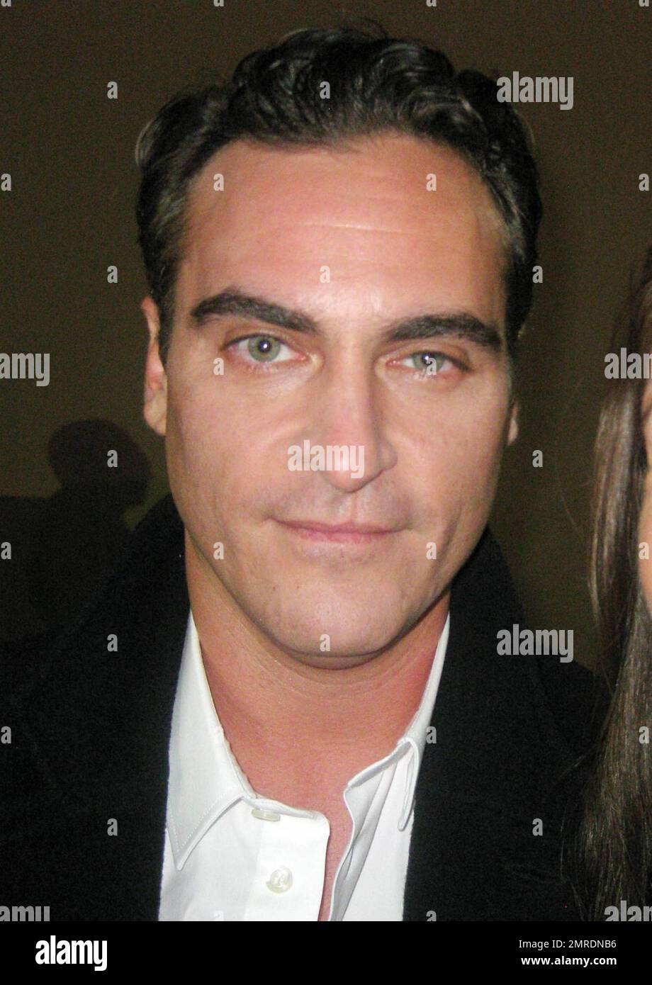 Freshly shaven actor Joaquin Phoenix signs autographs for fans as he ...