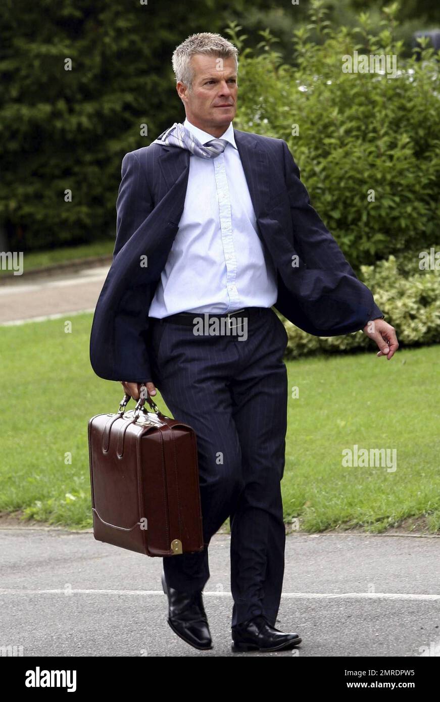 Liverpool midfielder Joe Cole's lawyer arrives for a sentencing hearing ...