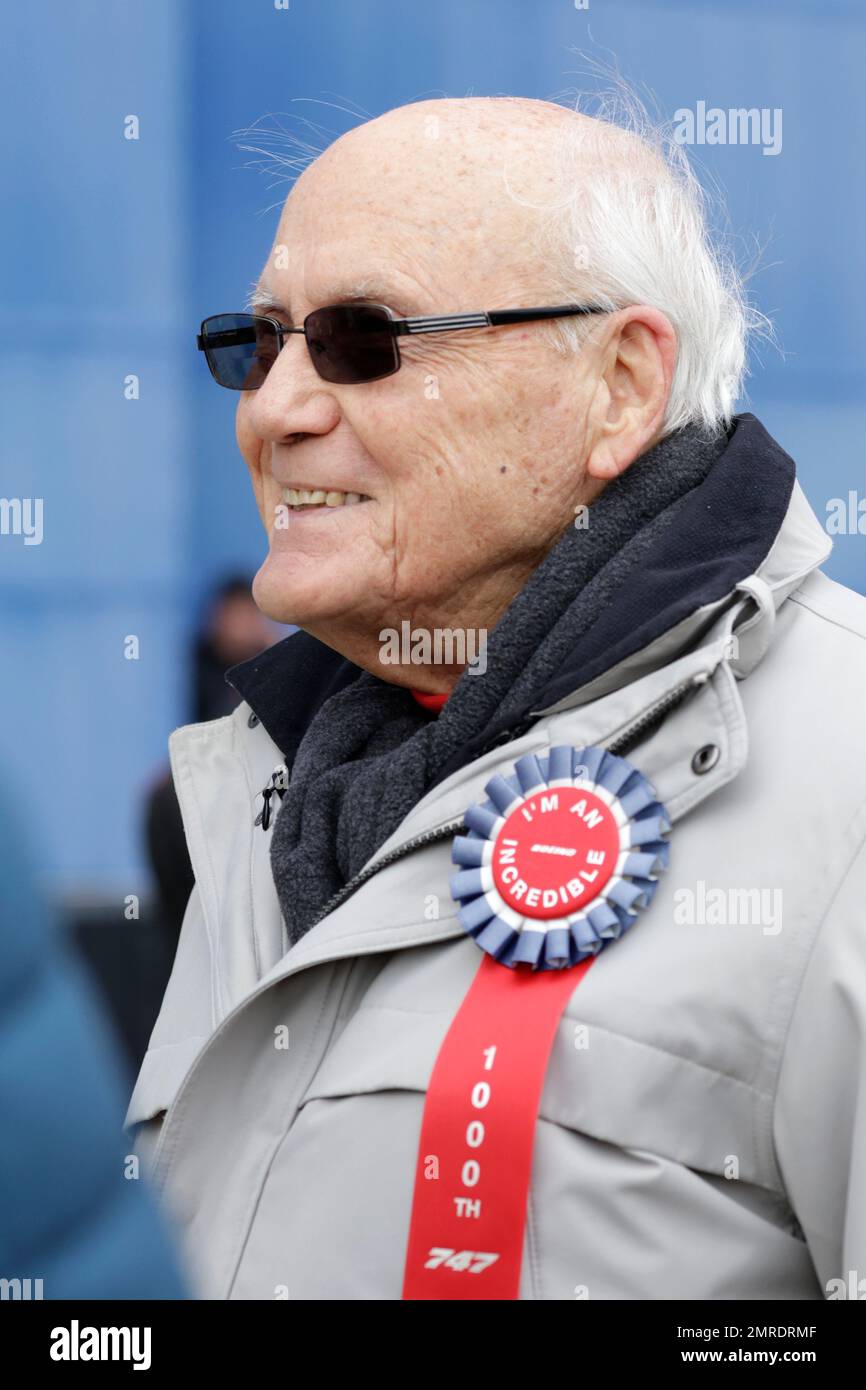 Retired Boeing worker Scott Tompkins speaks to the media before a ...