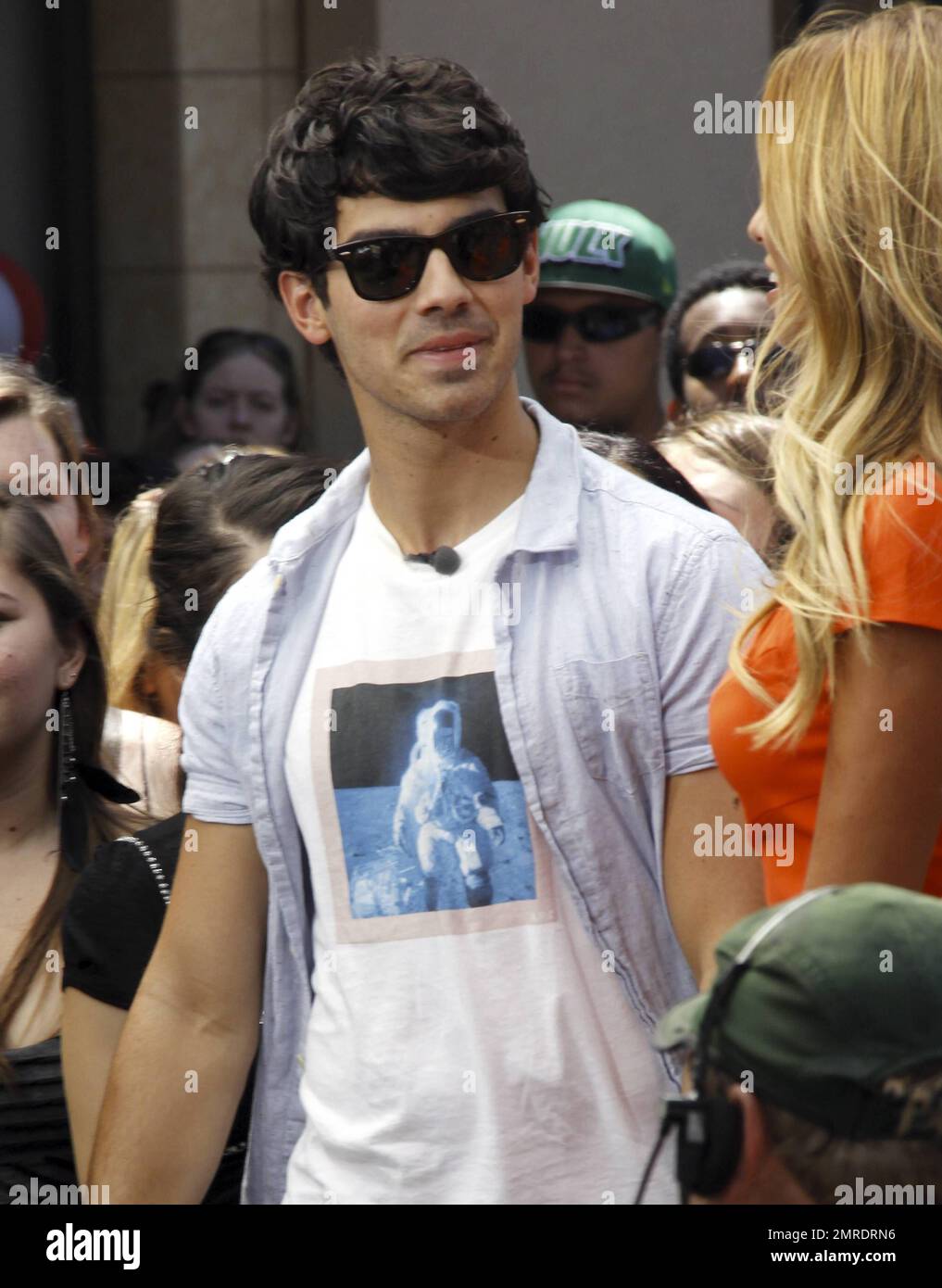 Singer Joe Jonas is presented with a birthday cake featuring an image ...