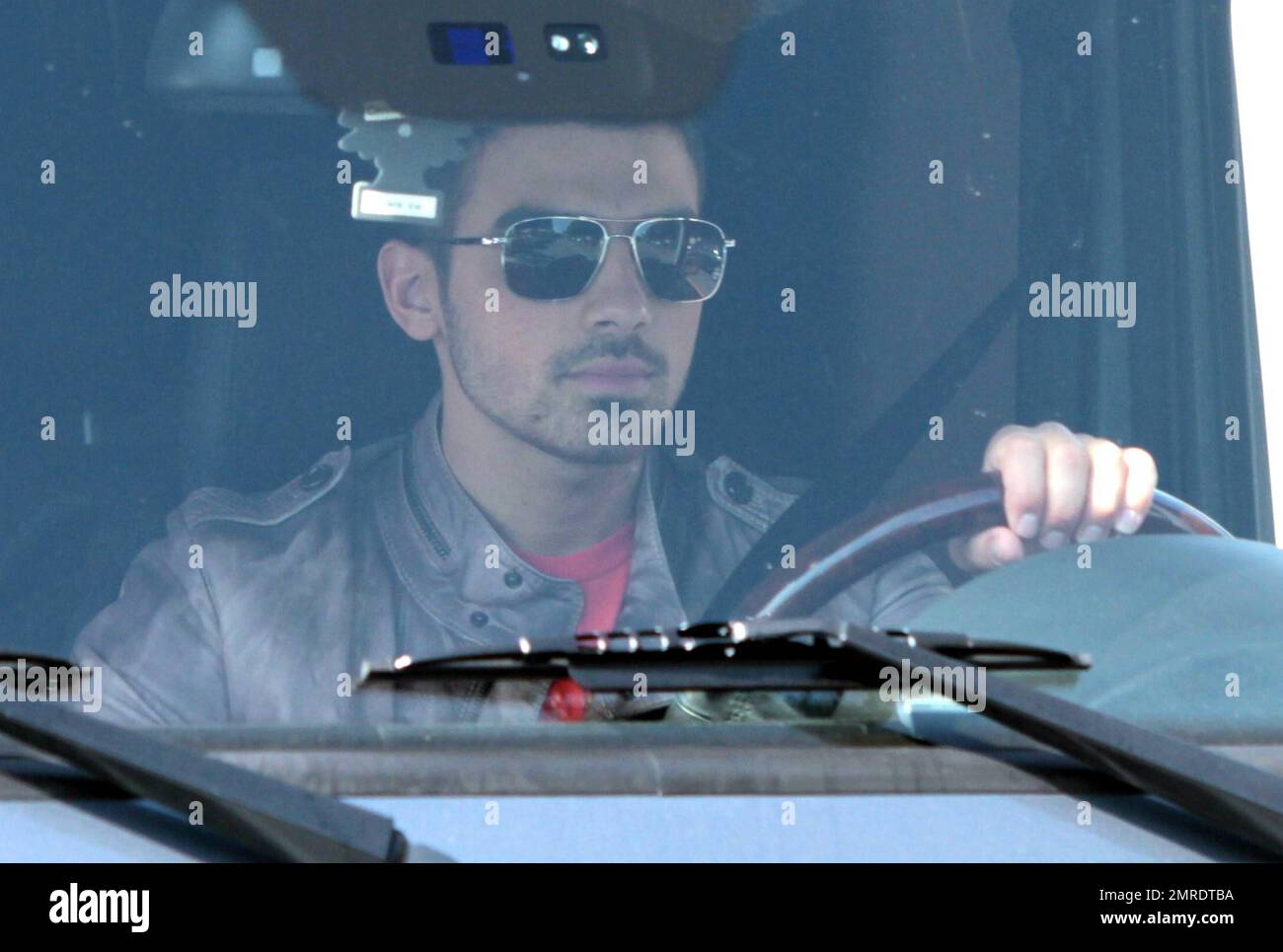 EXCLUSIVE!! Joe Jonas carries along a coffee drink as he leaves his ...