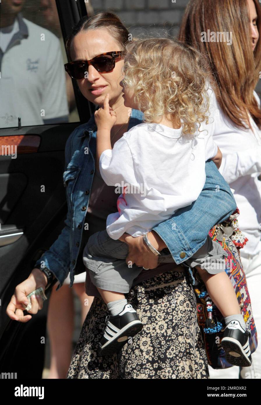 Jennifer Meyer holding son Otis Tobias Maguire while leaves Joel Silver ...