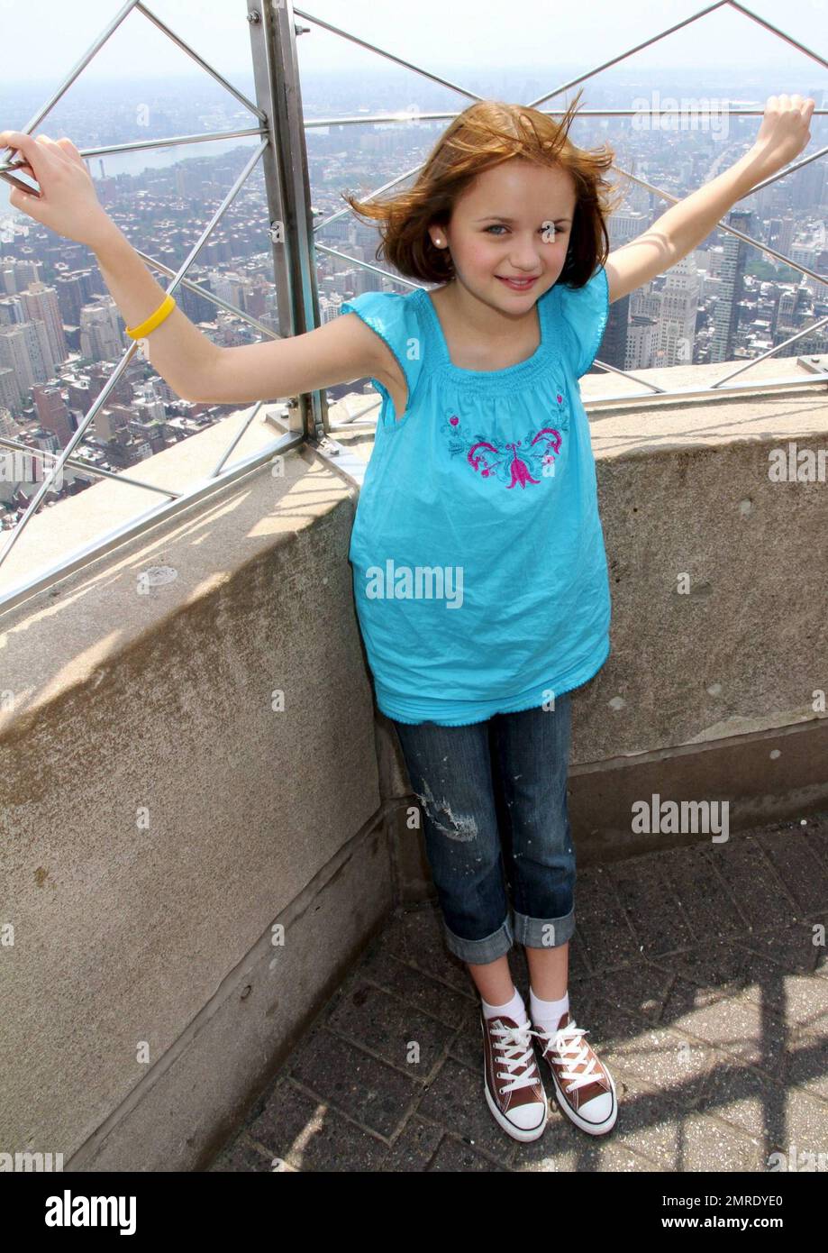Joey King poses for photos on top of the Empire State Building during a ...