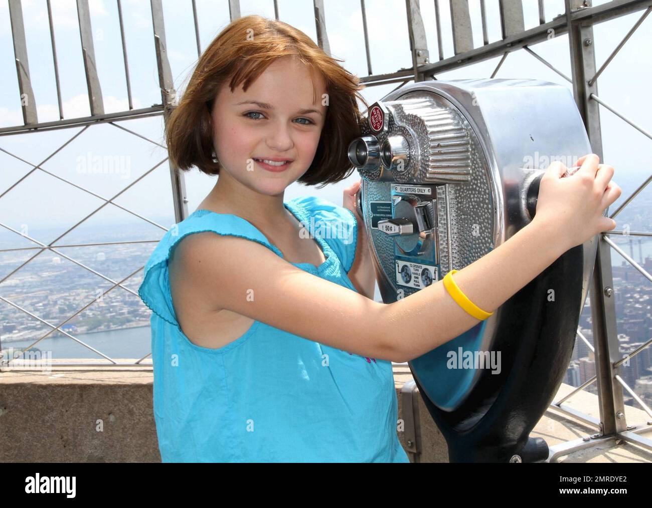 Joey King poses for photos on top of the Empire State Building during a ...