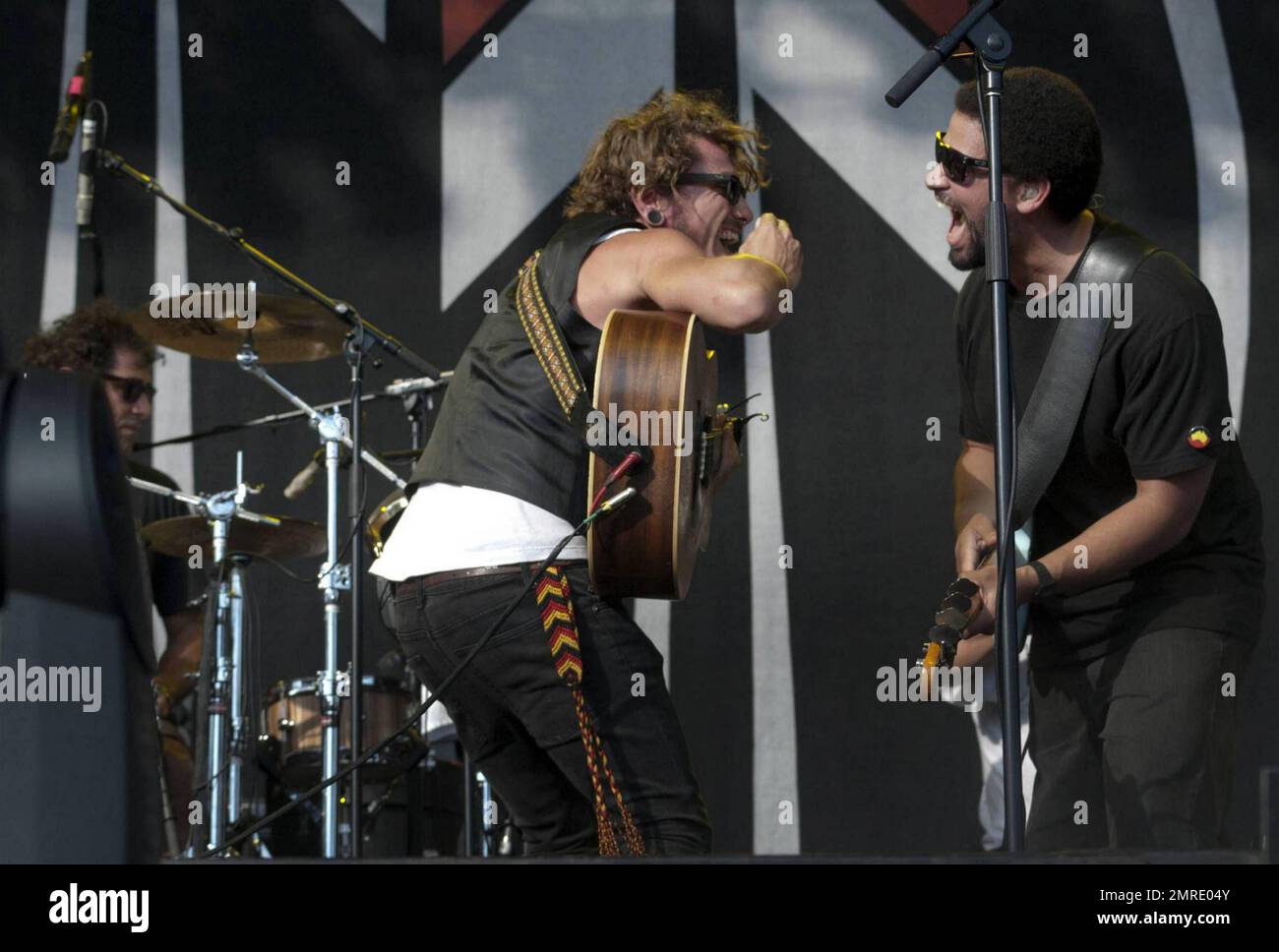 Australian musician John Butler sings and plays the guitar and bango ...