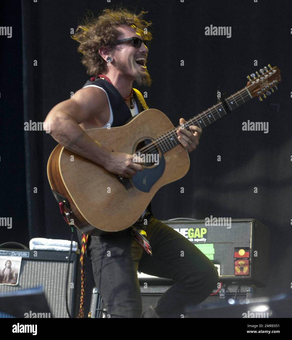 Australian musician John Butler sings and plays the guitar and bango ...