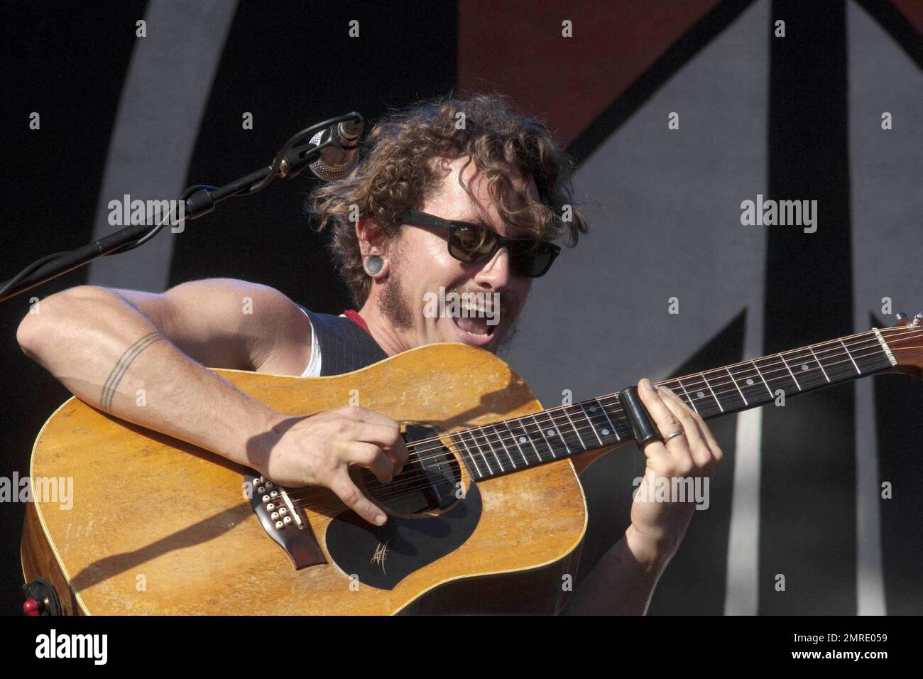 Australian musician John Butler sings and plays the guitar and bango ...