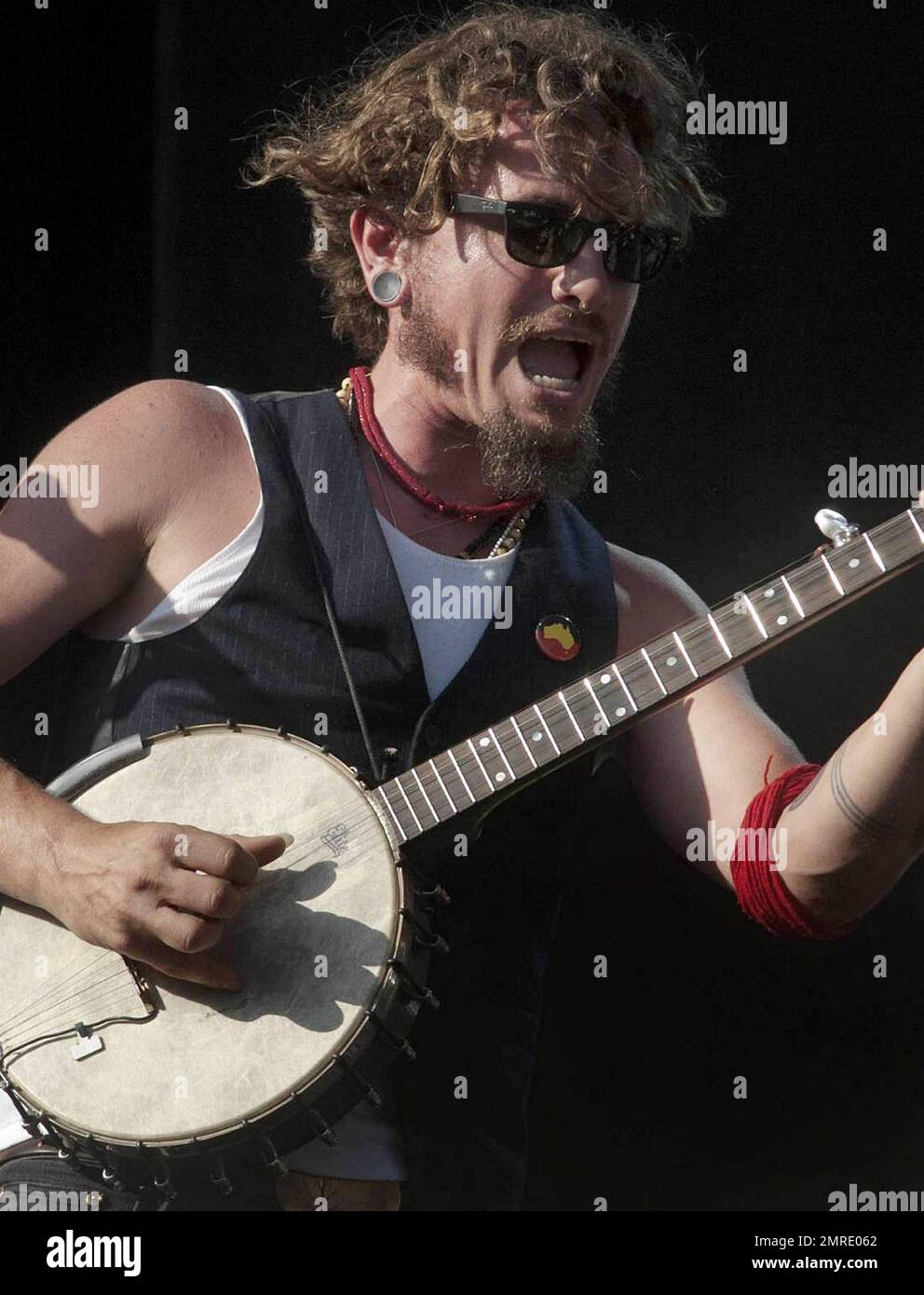 Australian musician John Butler sings and plays the guitar and bango ...