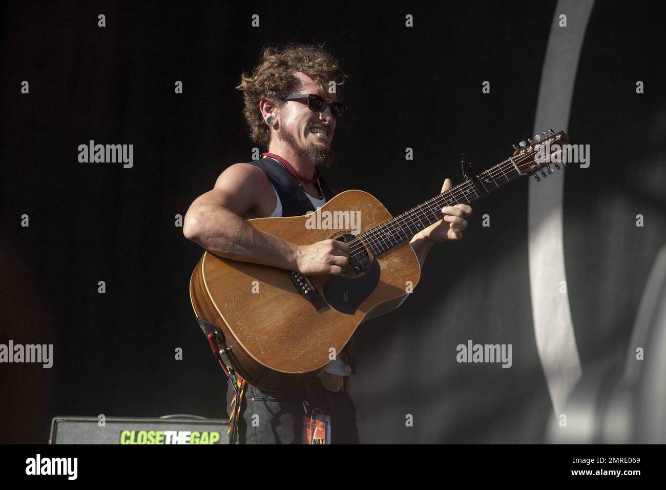 Australian musician John Butler sings and plays the guitar and bango ...