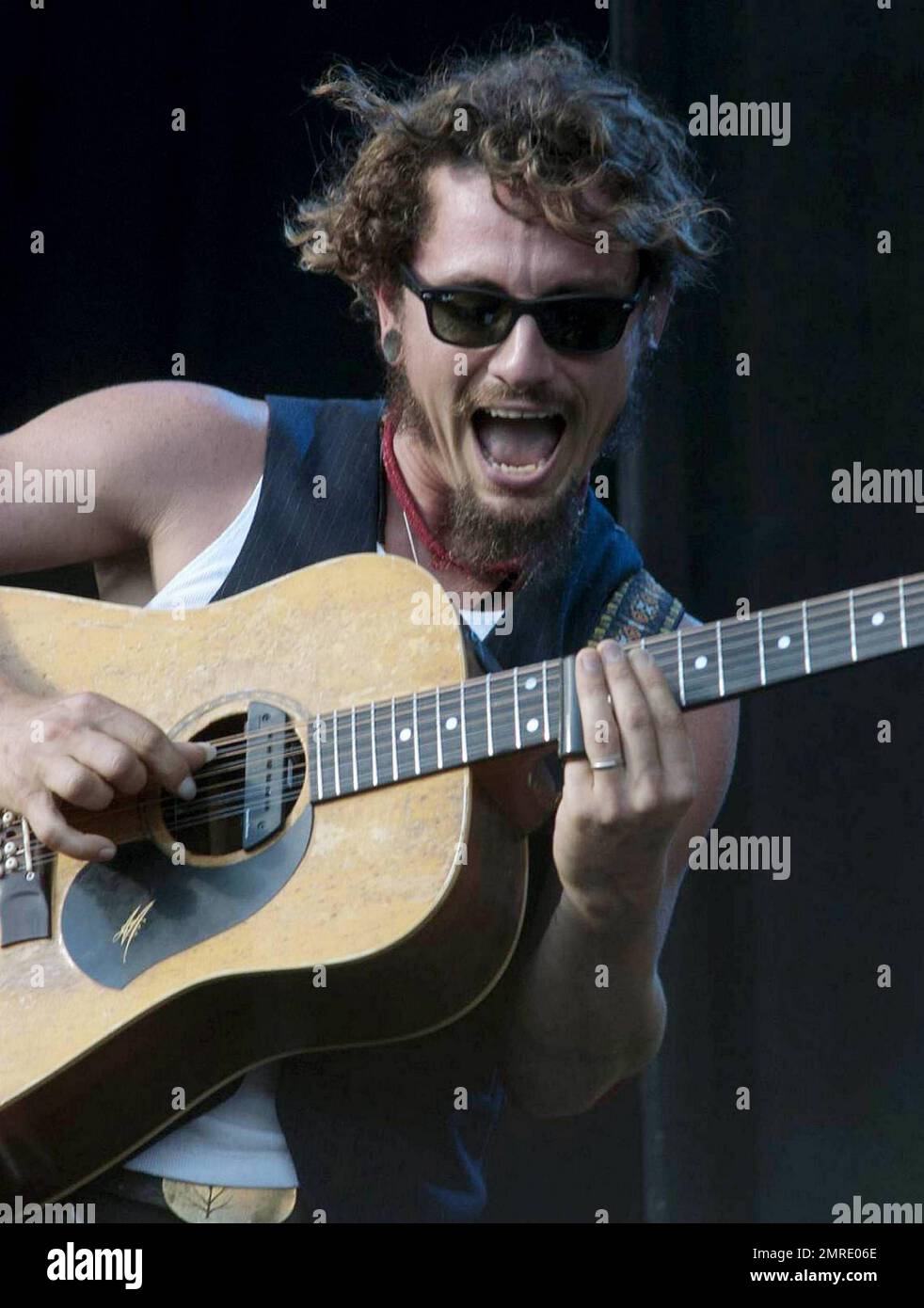 Australian musician John Butler sings and plays the guitar and bango ...