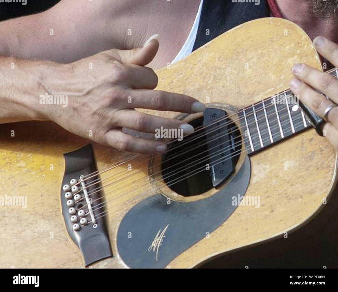 Australian musician John Butler sings and plays the guitar and bango ...