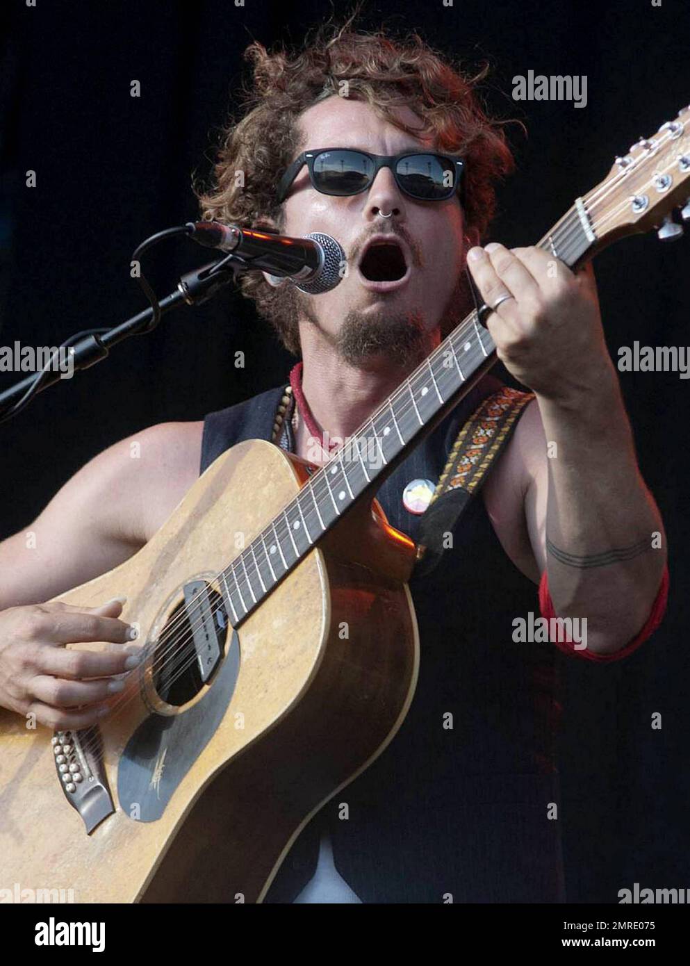 Australian musician John Butler sings and plays the guitar and bango ...