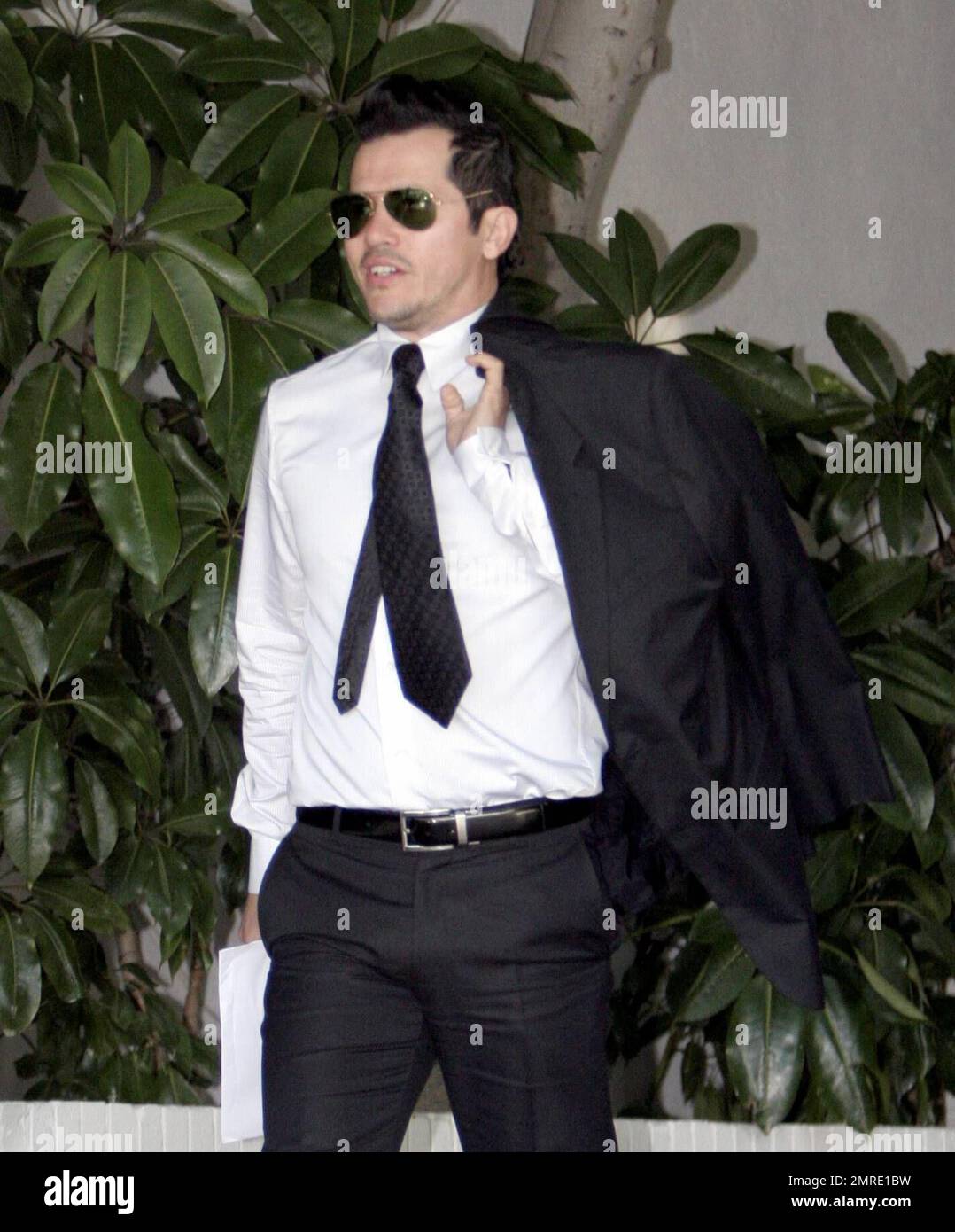 Columbian born actor John Leguizamo leaves his hotel to make his way to ...