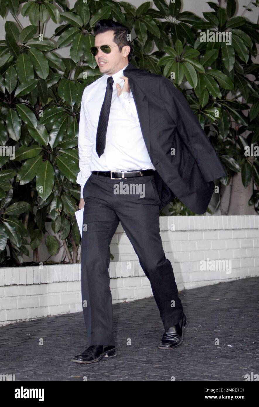 Columbian born actor John Leguizamo leaves his hotel to make his way to ...