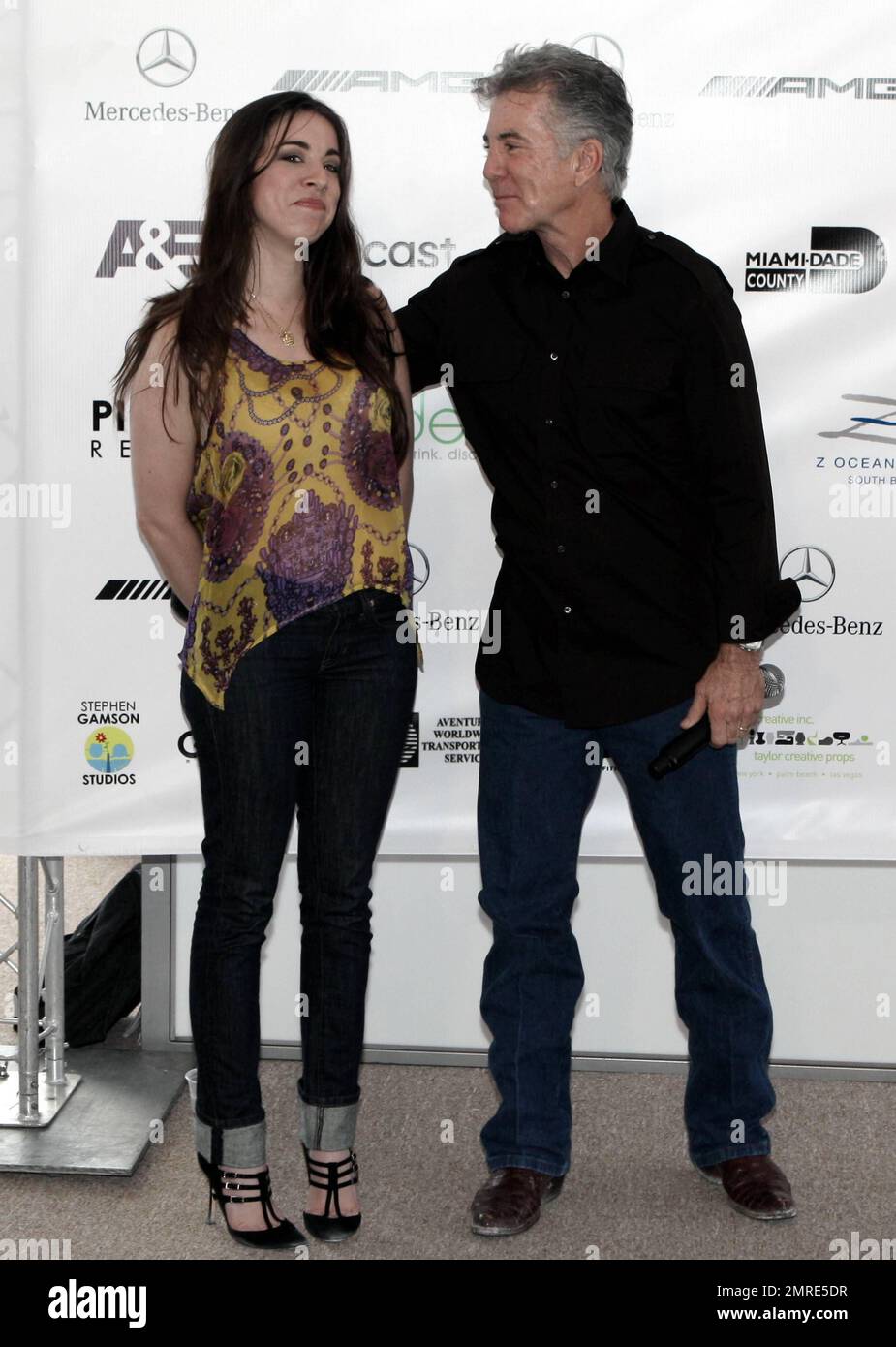 John Walsh and daughter Megan pose for photos at the VIP tent during ...
