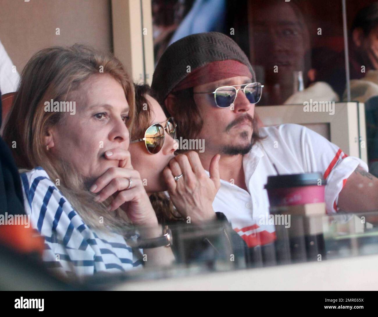 EXCLUSIVE!! Johnny Depp relaxes with a drink whilst watching the Miami ...