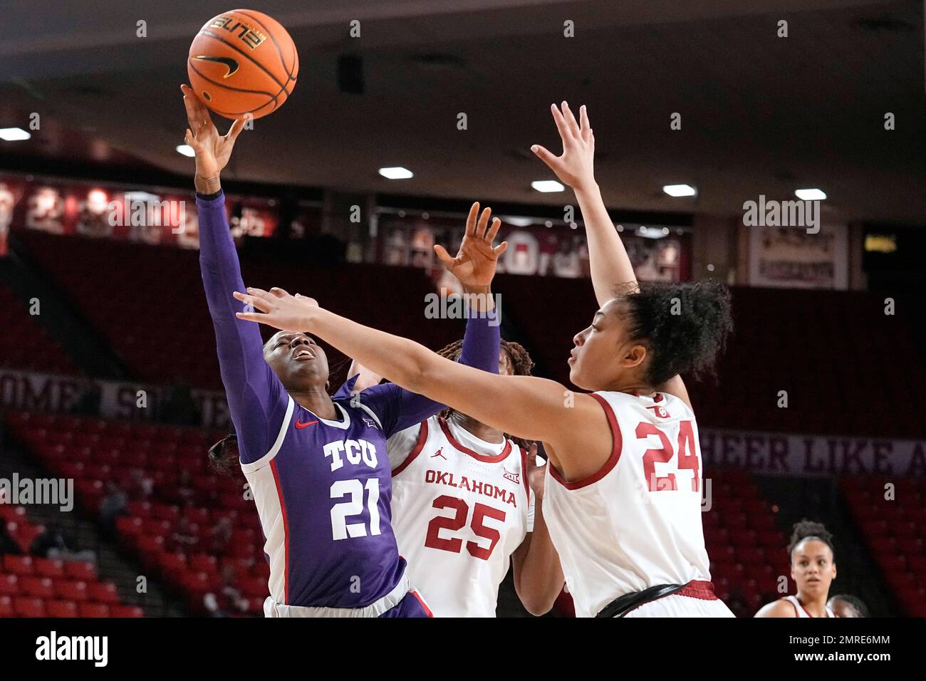 TCU forward Lucy Ibeh (21) shoots as Oklahoma guard Skylar Vann (24 ...
