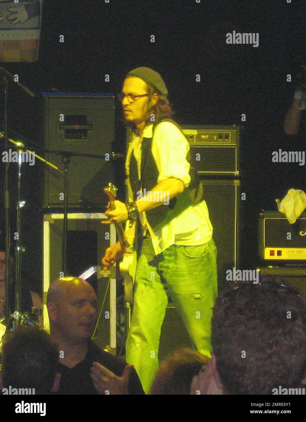 Heart throb actor Johnny Depp joined his old band 'The Kids" on stage ...