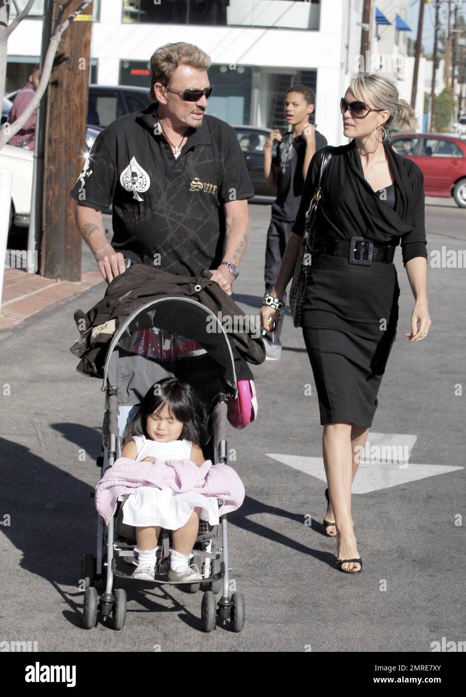 Johnny Hallyday and his wife Laeticia Boudou take adopted daughter Jade ...