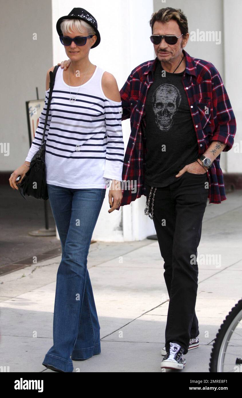 French singer and actor Johnny Hallyday strolls with wife Laeticia ...