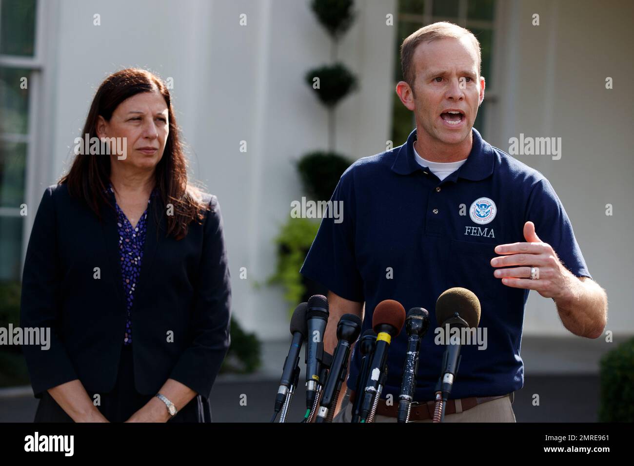 Acting Secretary of Homeland Security Elaine Duke, left, looks on as ...