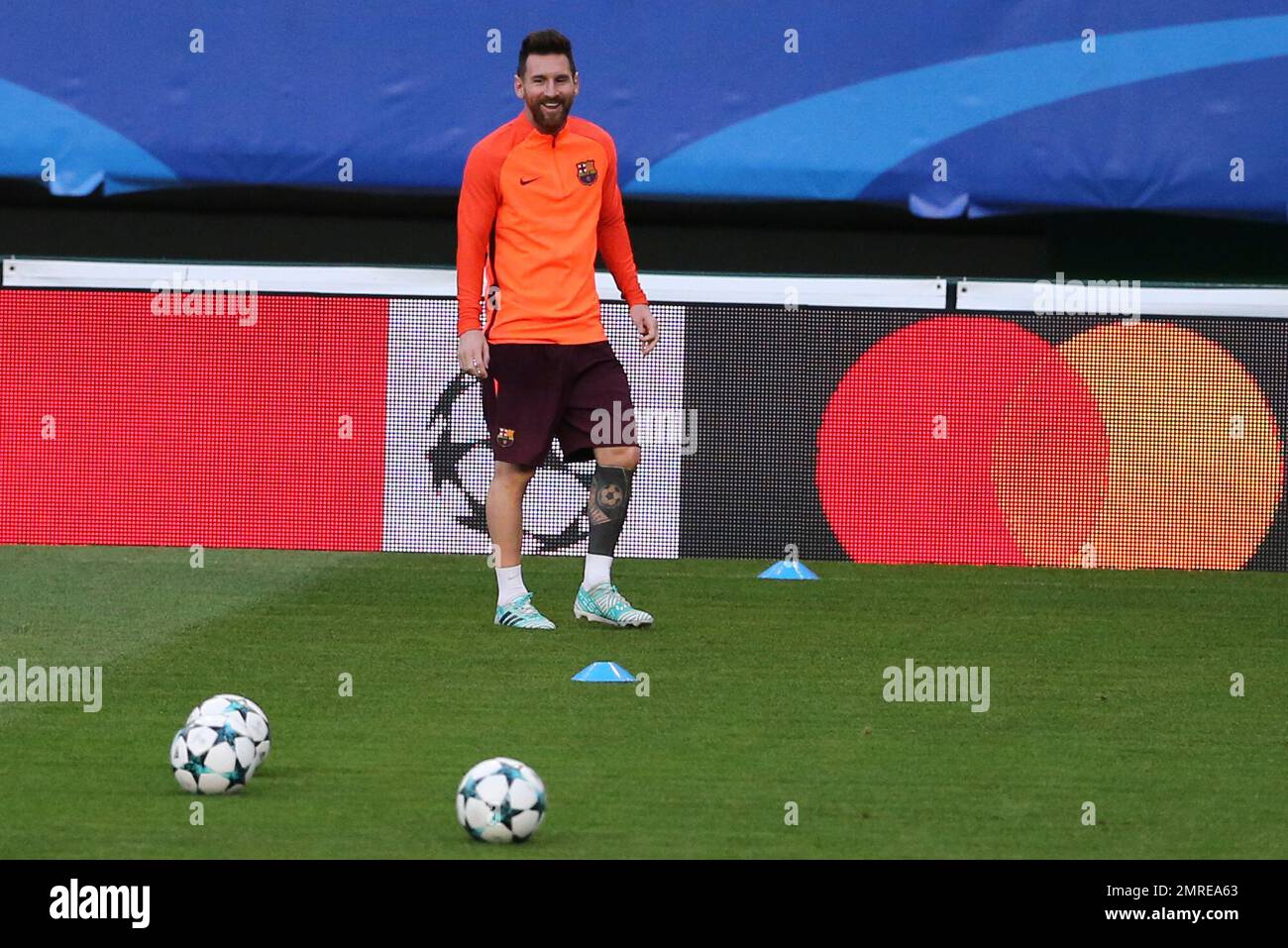Barcelona's Lionel Messi smiles during a training session at the ...
