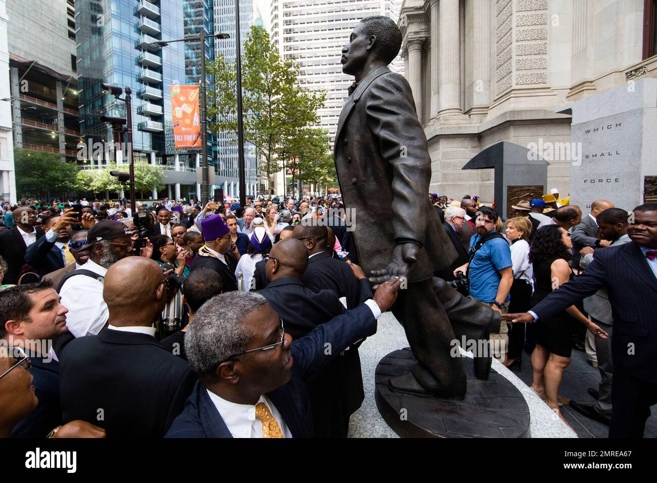 A crowd gathers around a statue of Octavius Valentine Catto at an ...