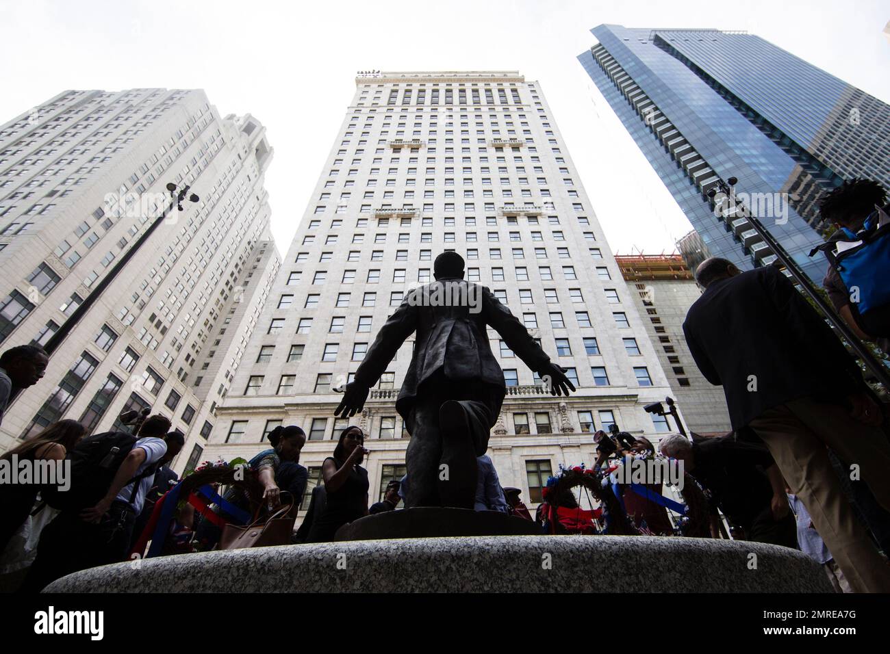 A crowd gathers around a statue of Octavius Valentine Catto at an ...