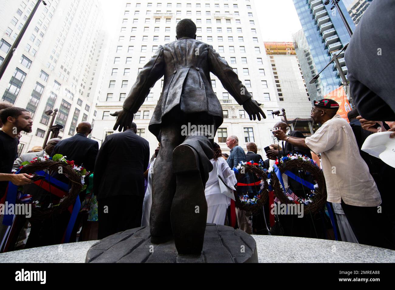 A crowd gathers around a statue of Octavius Valentine Catto at an ...