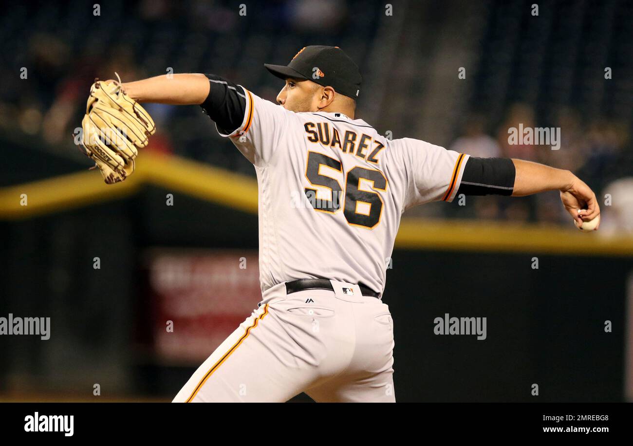 San Francisco Giants' Albert Suarez throws a pitch against the Arizona ...