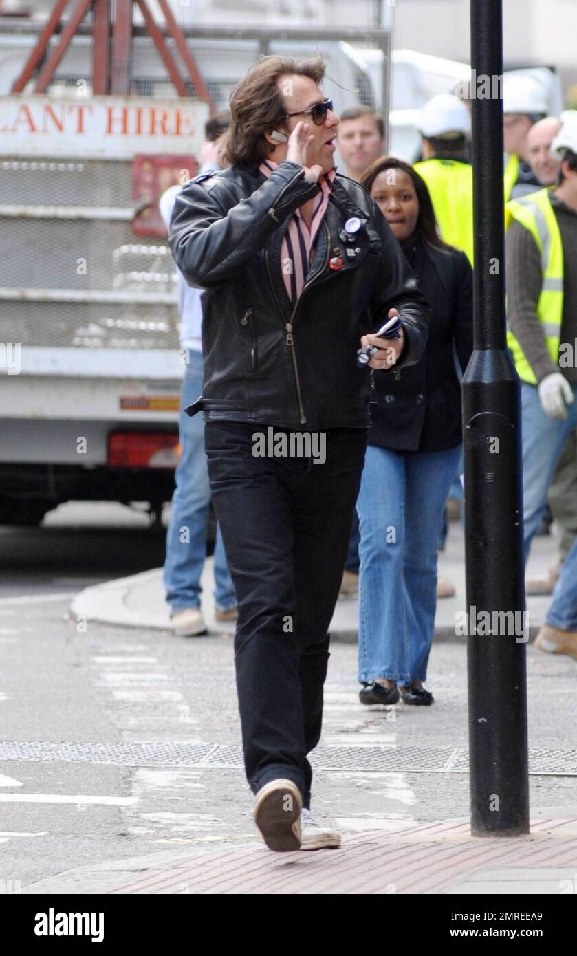 TV and radio presenter Jonathan Ross flashes a peace sign and says ...