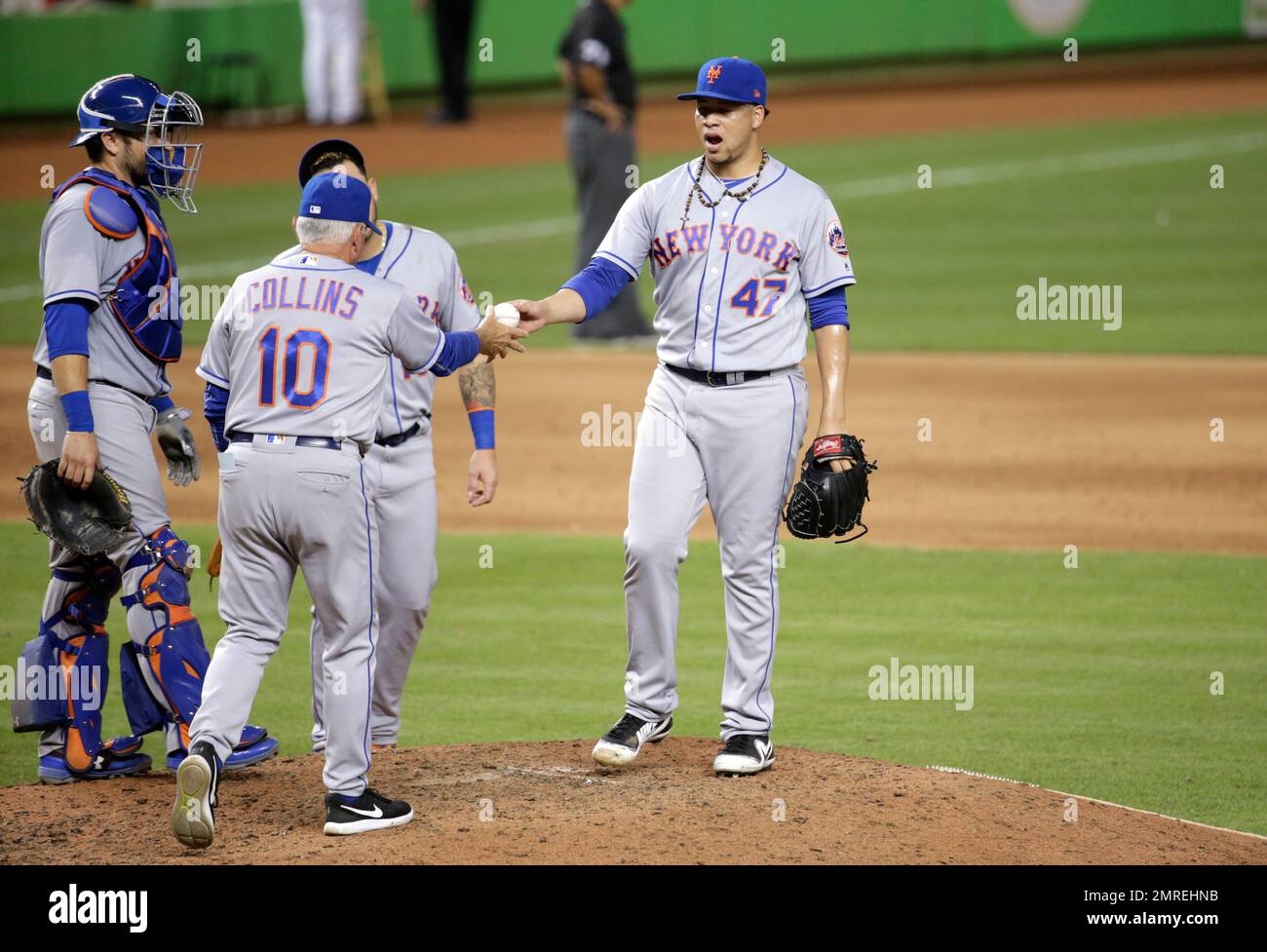 New York Mets relief pitcher Hansel Robles (47) hands the ball to ...