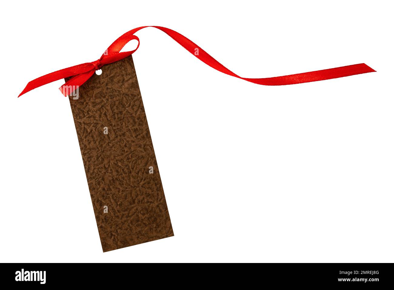 A blank brown rustic paper cloth tag or label with red ribbon isolated ...