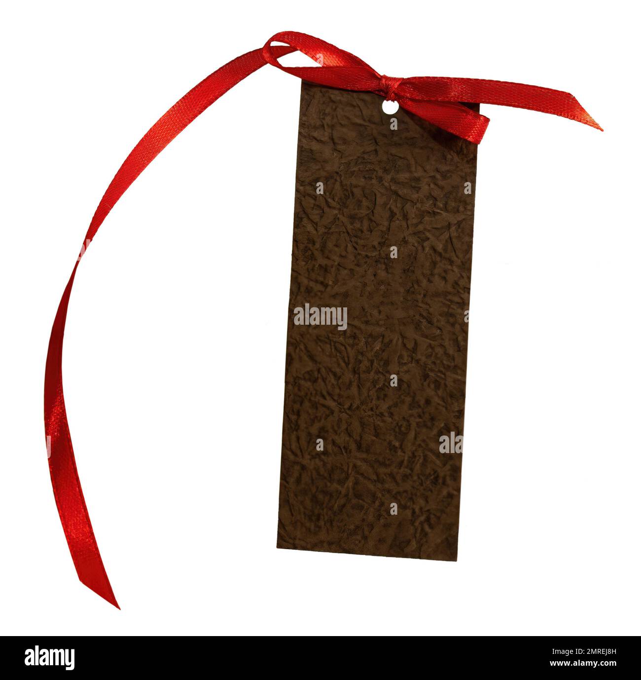 A blank brown rustic paper cloth tag or label with red ribbon isolated ...