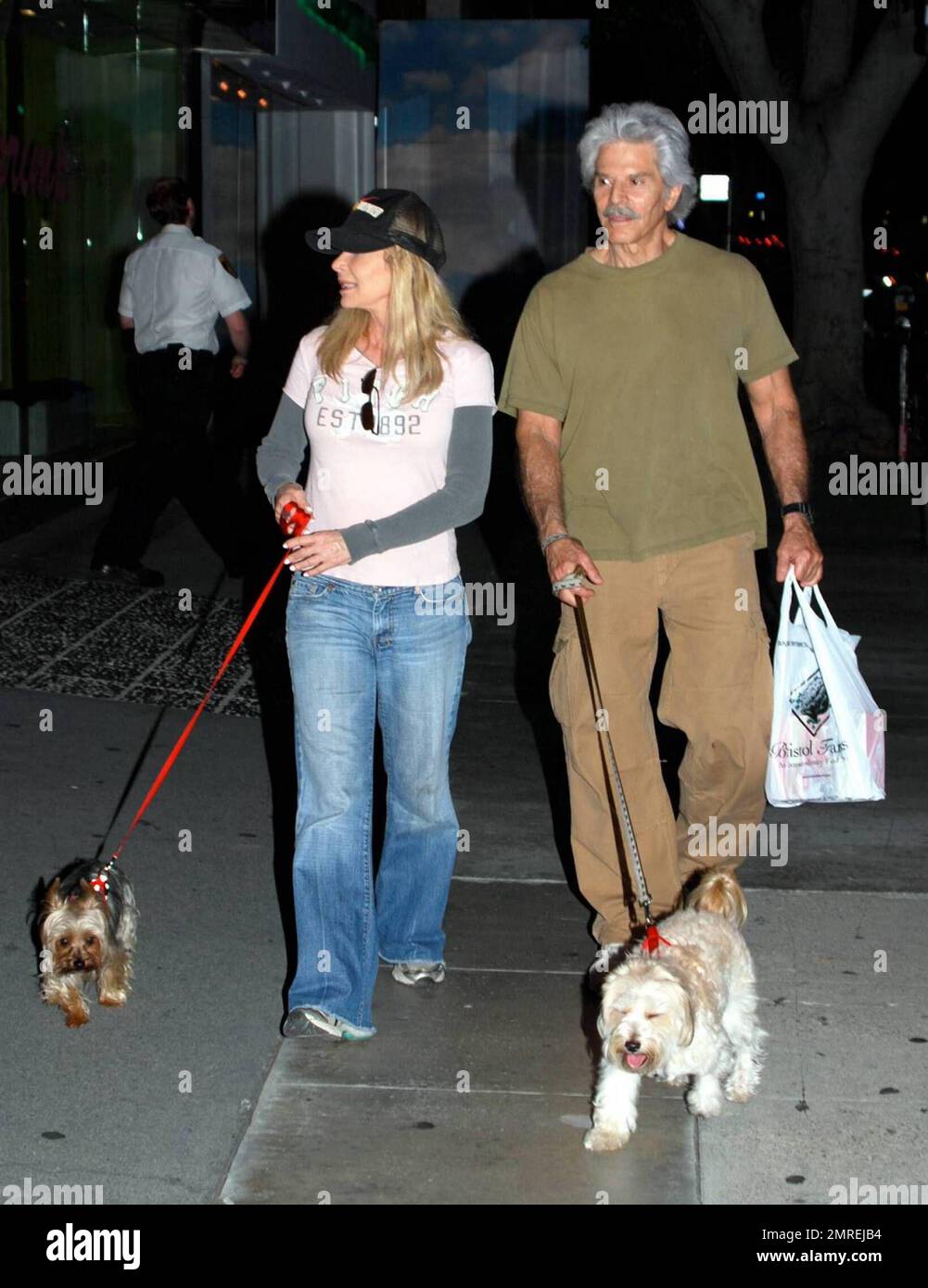 Mexican actor of Spanish descent Jorge Rivero walks his dogs with a ...