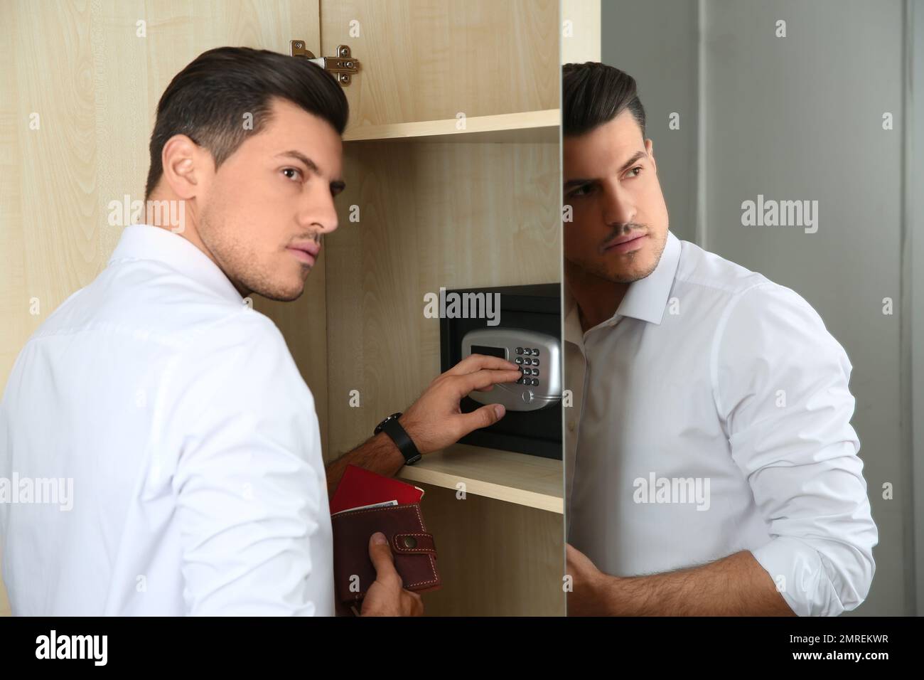 Man opening black steel safe with electronic lock at hotel Stock Photo ...