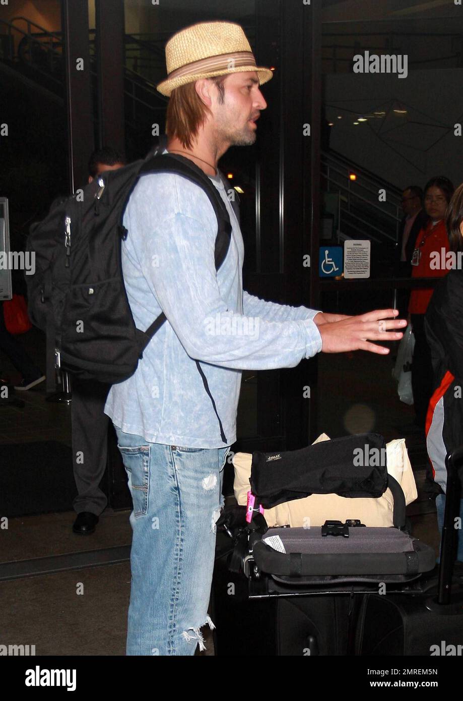 "Lost" actor Josh Holloway at LAX with wife Yessica Kumala and their ...